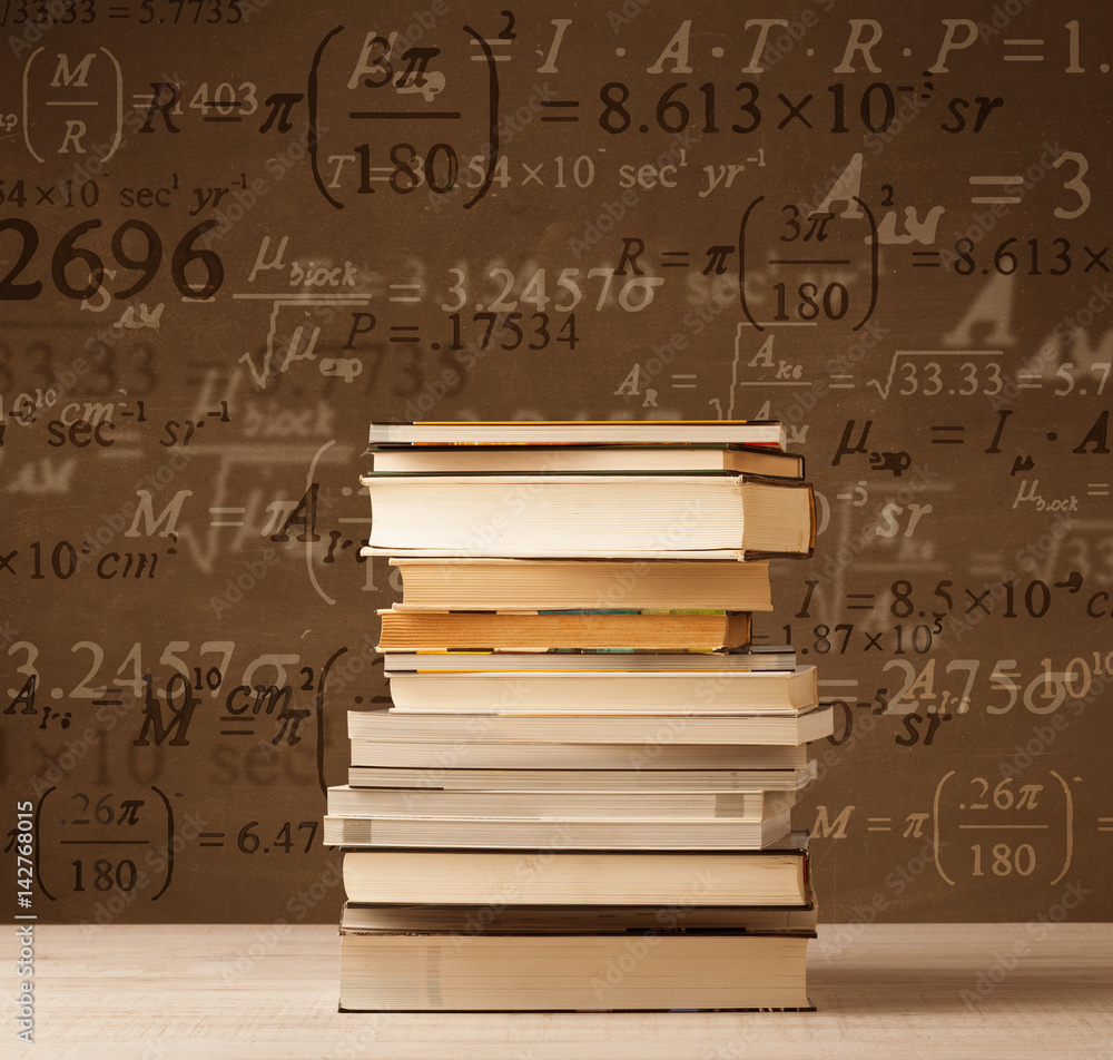 Books on vintage background with math formulas Stock-Foto | Adobe Stock