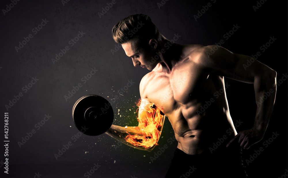 Bodybuilder athlete lifting weight with fire explode arm concept Stock ...