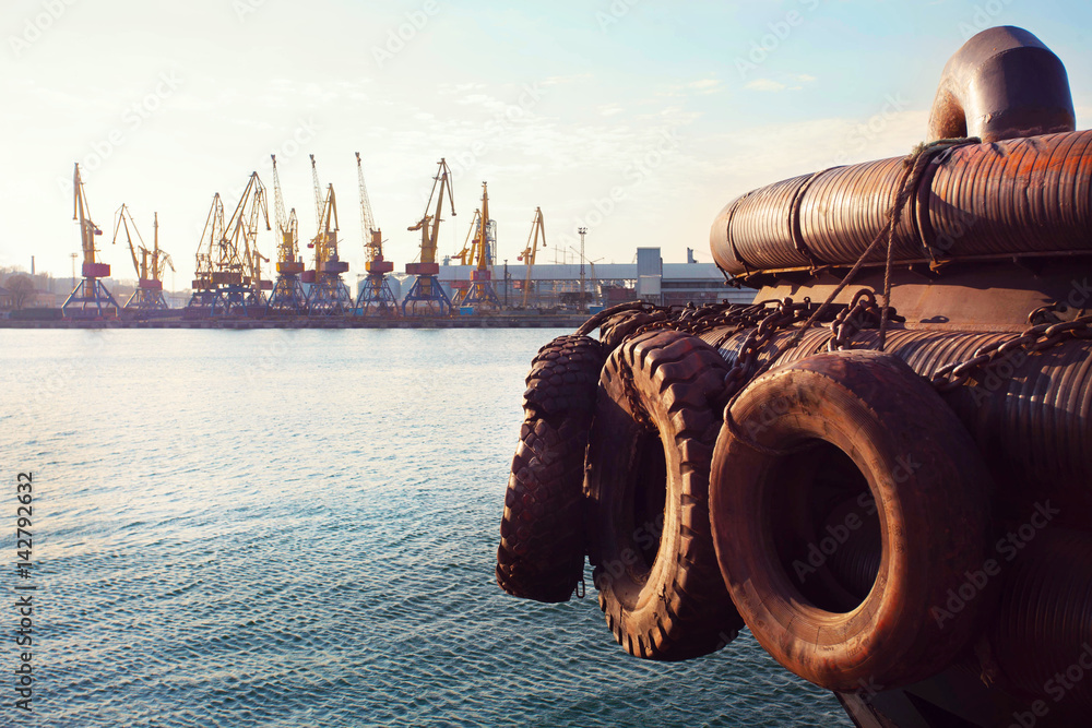 Container Cargo Ship with working crane bridge in shipyard background ...