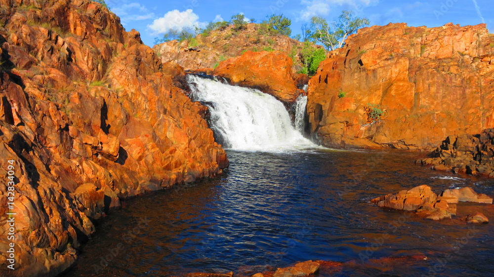 Beautiful Edith Falls waterfall with red rocks in the Northern ...
