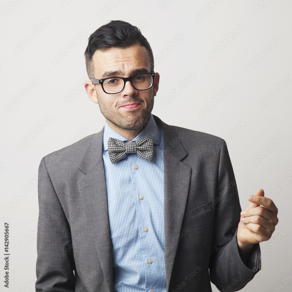 Annoyance on face of young businessman. Gestures, facial expressions ...