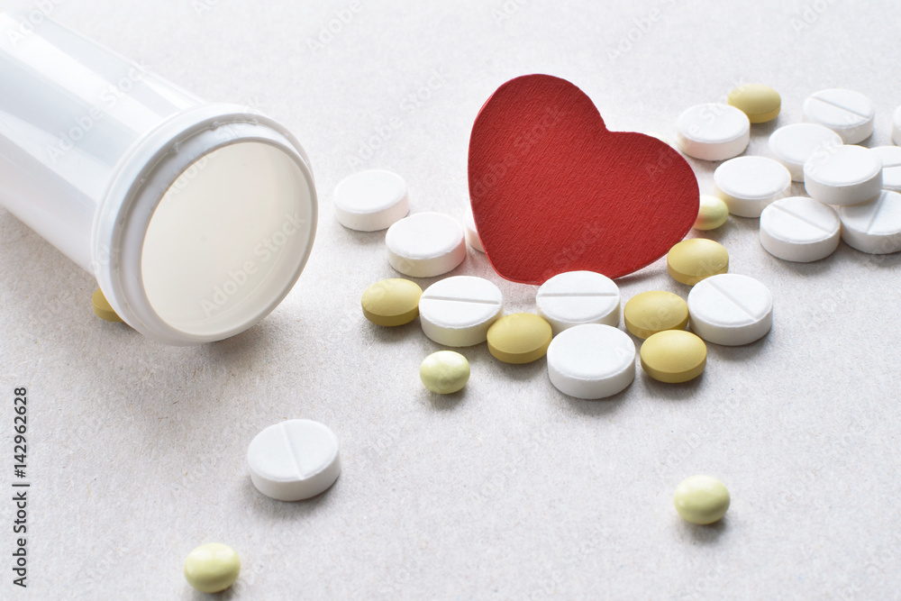 heart pills with empty plastic bottle Stock Photo | Adobe Stock
