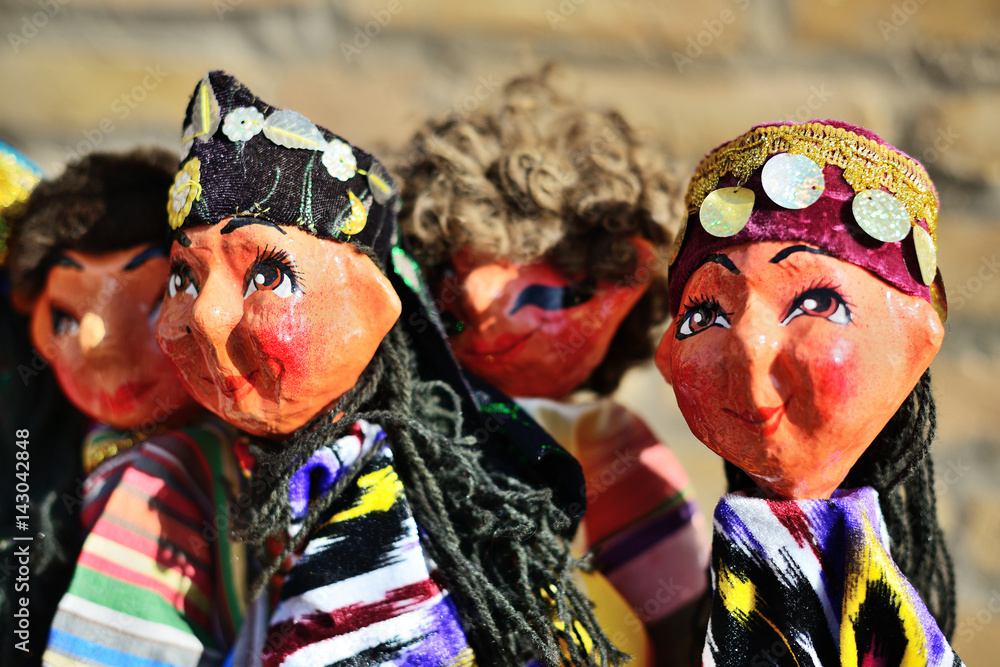 Traditional souvenir painted mashed paper (papier mache) dolls dressed ...