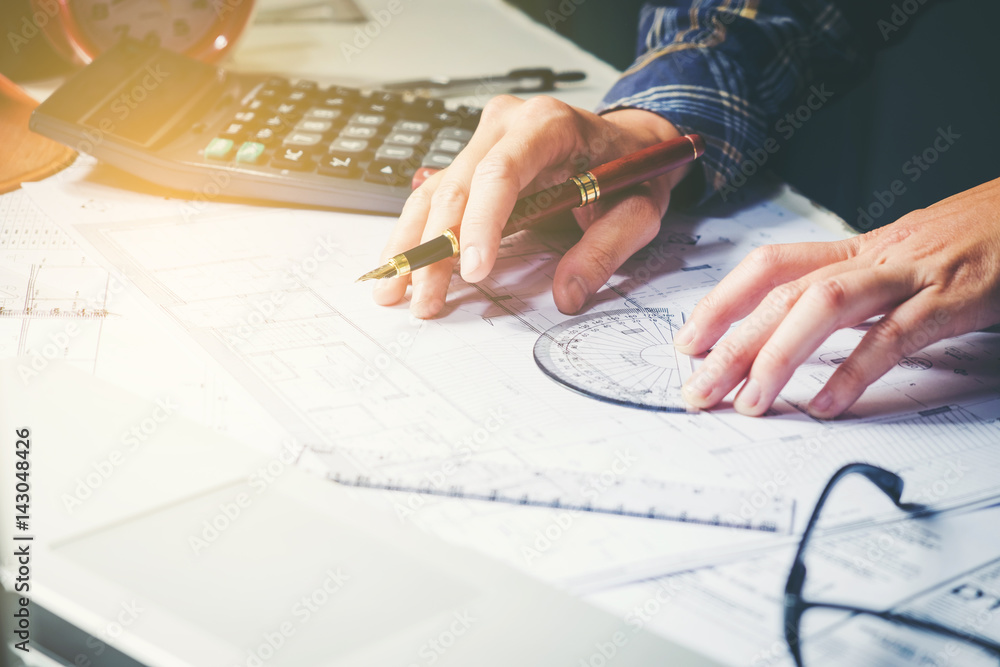 Architect or engineer working in office on blueprint. Architects ...