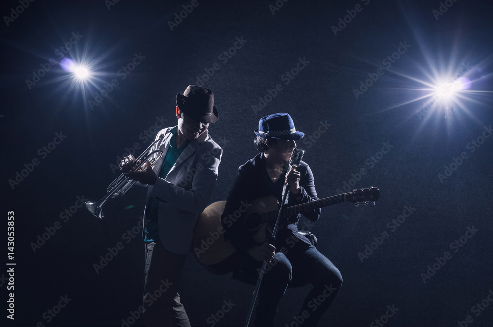 Musician Duo band playing a trumpet and singing a song and playing the ...