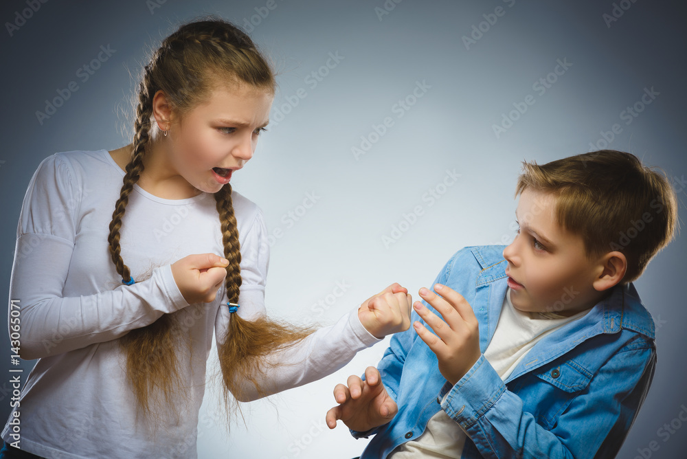 angry girl shouting at frightened dissatisfied boy. Communication ...