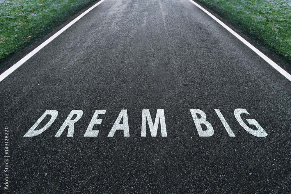 Asphalt road road going straight up with dream big text message ...