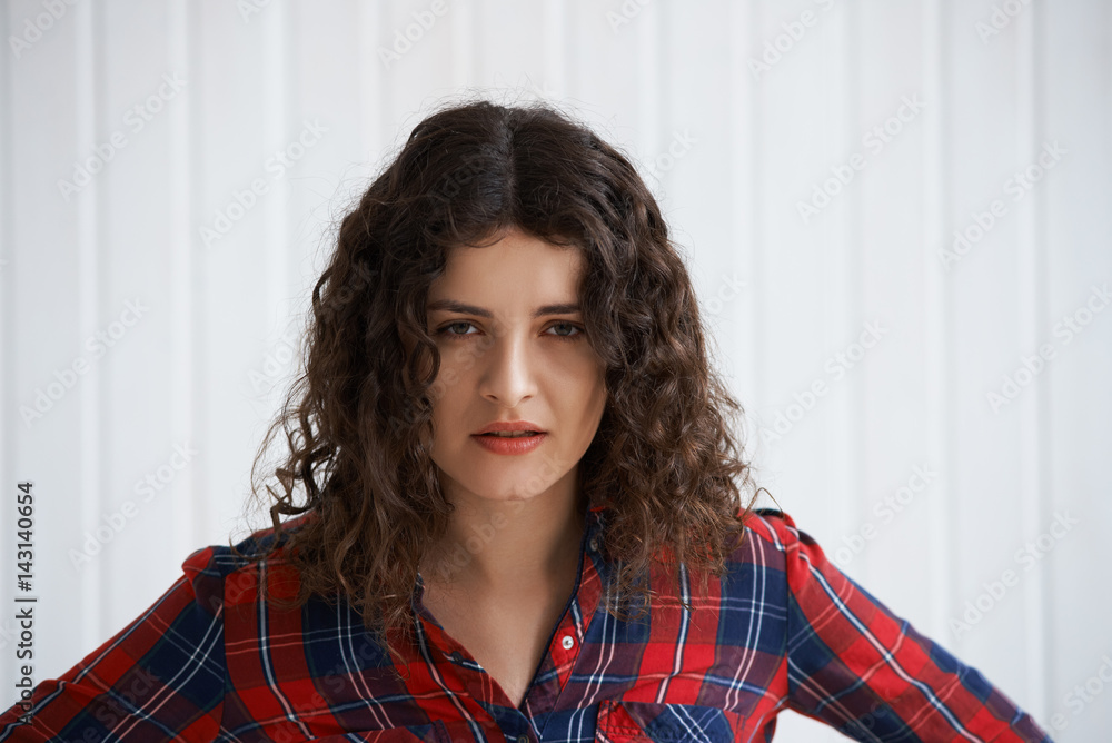 Hot look woman with strict look. Temperamental brunette girl in red ...