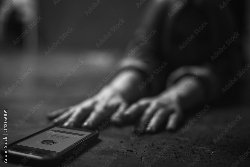 Kidnapped woman trying getting to her phone Stock Photo | Adobe Stock