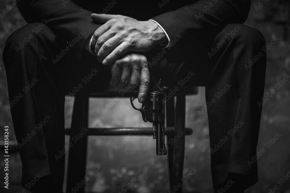 Wicked Man Holding His Gun At The Ready Stock Photo Adobe Stock wicked-man-holding-his-gun-at-the-ready-stock-photo-adobe-stock