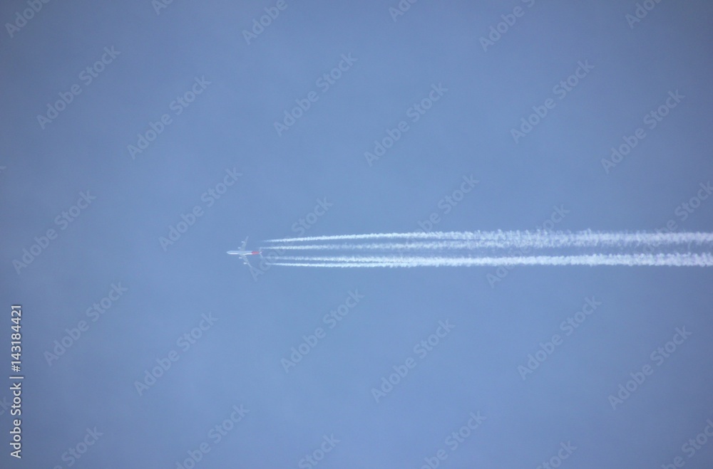 Plane with smoke trails Stock Photo | Adobe Stock