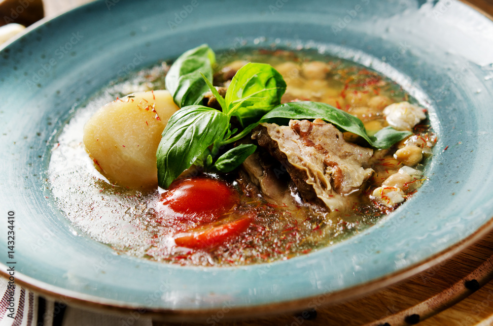 Soup with mutton broth with mutton meat, rice, chickpeas, potatoes ...