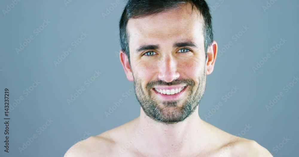 A beautiful portrait of man smiles and shines his white teeth and his ...