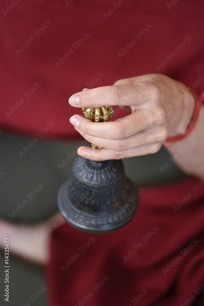 Buddhist prayer bell and meditation posture for a moment of relaxation ...