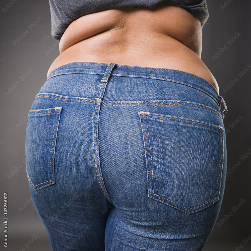 Woman With Fat Buttocks In Blue Jeans Overweight Female Body Closeup