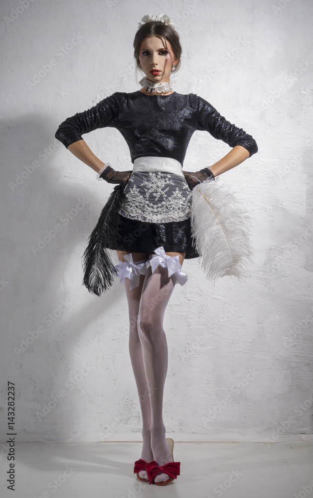 Woman in a fashionable maid costume Stock Photo | Adobe Stock