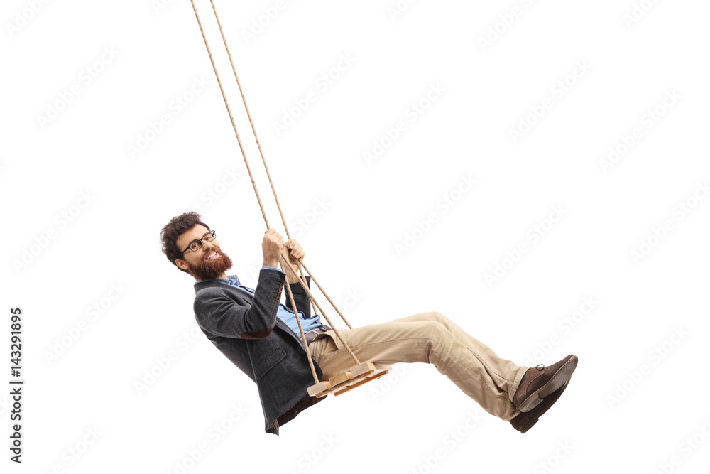 Bearded man swinging on a swing Stock Photo | Adobe Stock