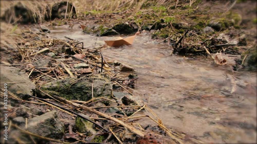 Paper origami gold, two successful paper boats sail along the river in ...
