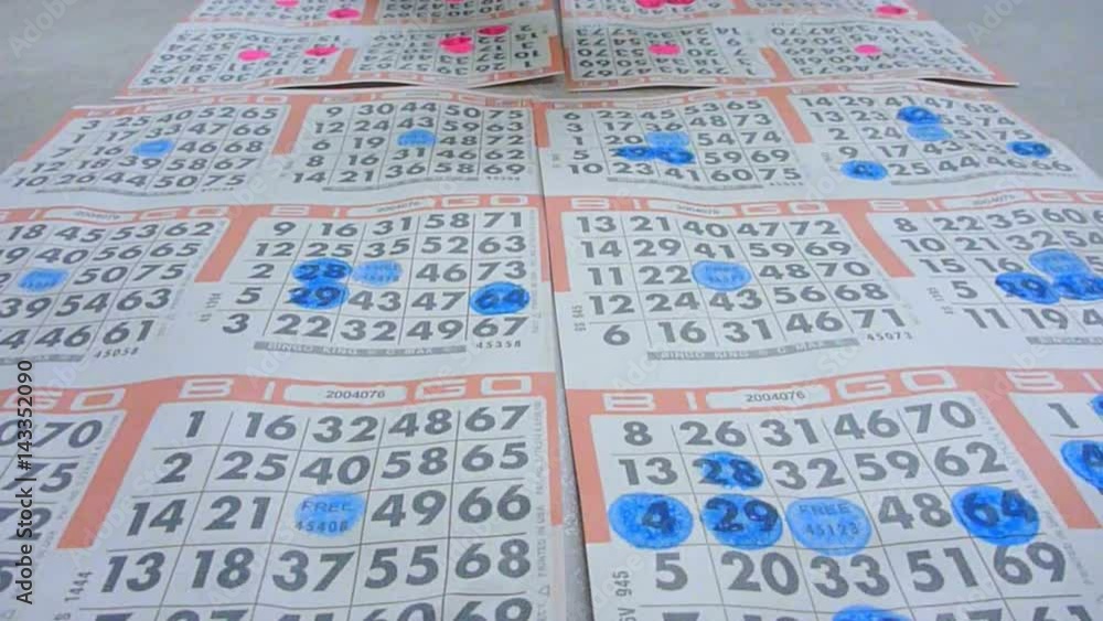 People daub ink on bingo cards in bingo hall time lapse. Stock ビデオ ...