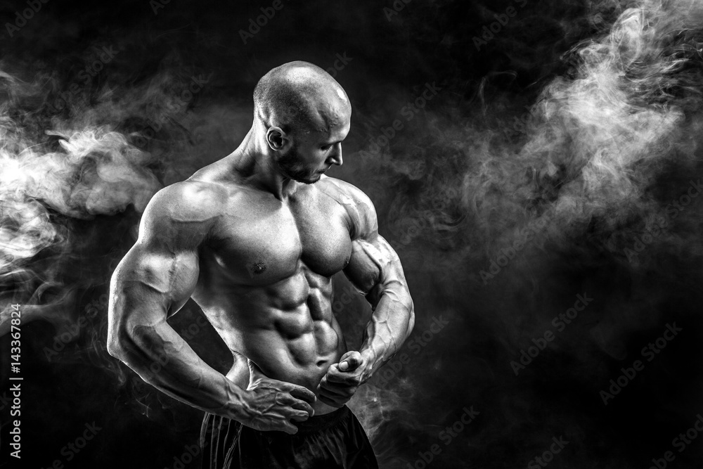 Strong bald bodybuilder with six pack. Bodybuilder man with perfect abs ...