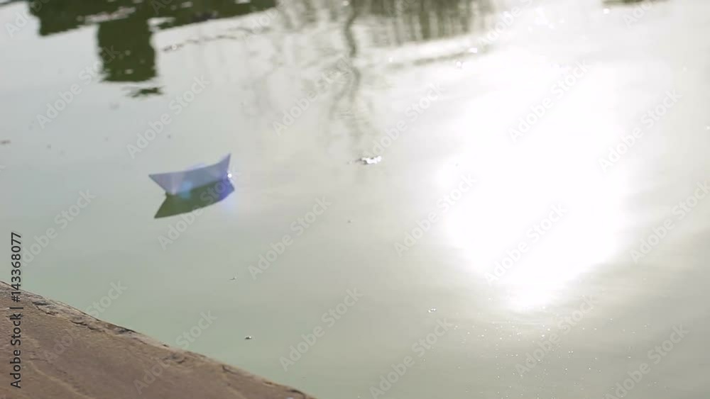 Paper boat floating on the river. Close-up Stock Video | Adobe Stock