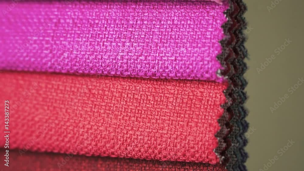Varieties of different color fabrics in the catalog. Shallow deep of ...