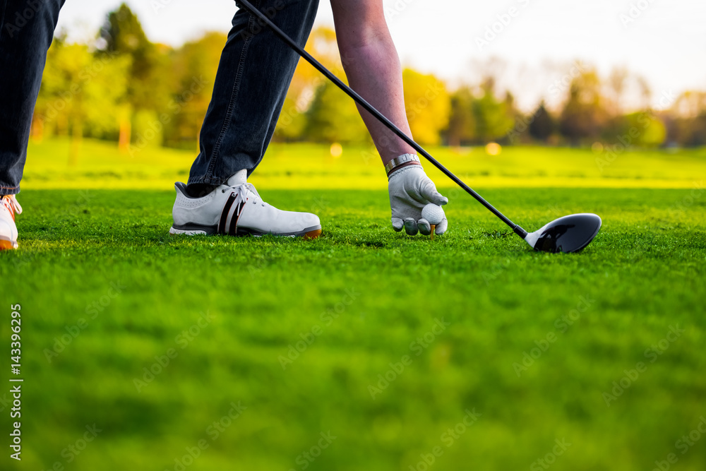 Man putting golf ball Stock-Foto | Adobe Stock