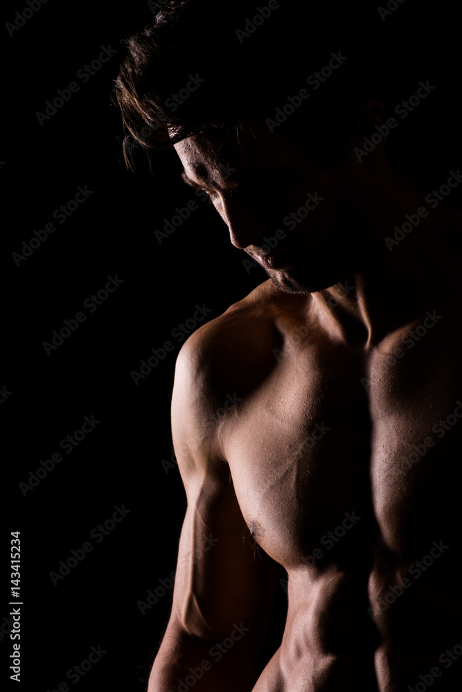 Muscular and defined six pack abs on handsome male model posing on ...