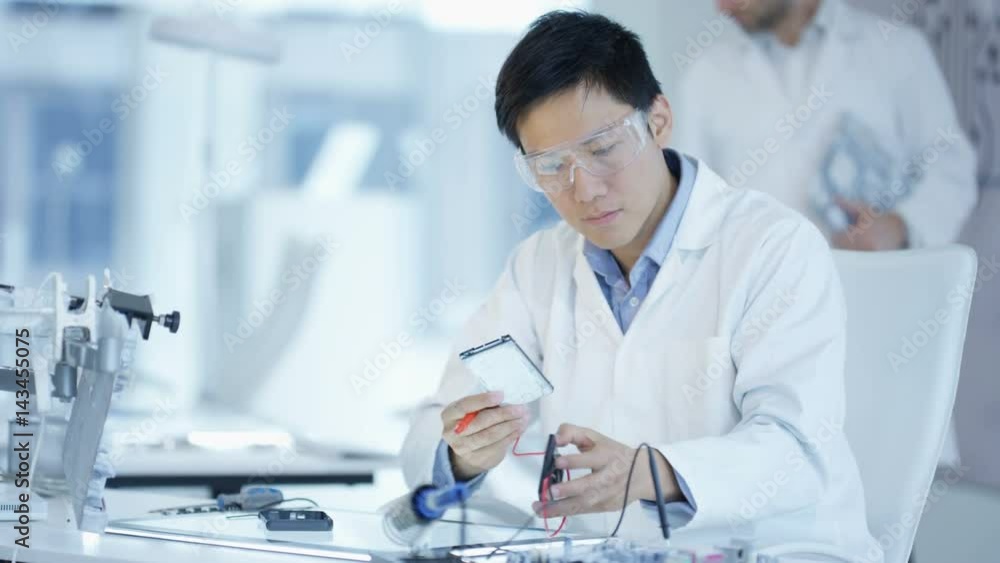Portrait serious electronics engineer working in the lab Stock Video ...