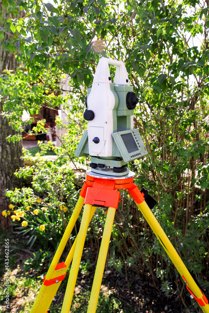 Total station. Survey Instrument geodetic device, total station set in ...