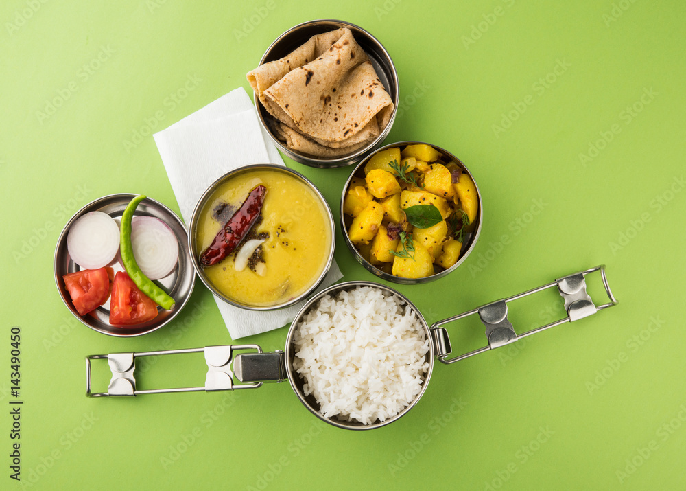 indian typical stainless steel lunch box or tiffin with north indian or ...