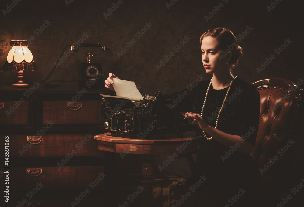 Beautiful young woman typing in retro interior Stock Photo | Adobe Stock
