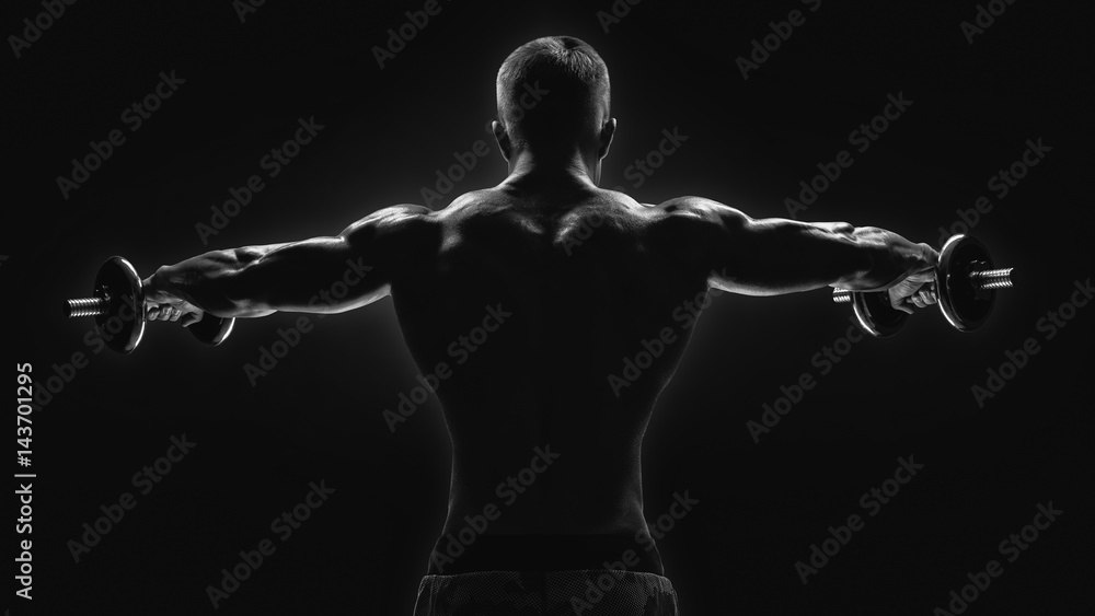 Black and white image of dumbbell lateral raise routine Bodybuilder ...