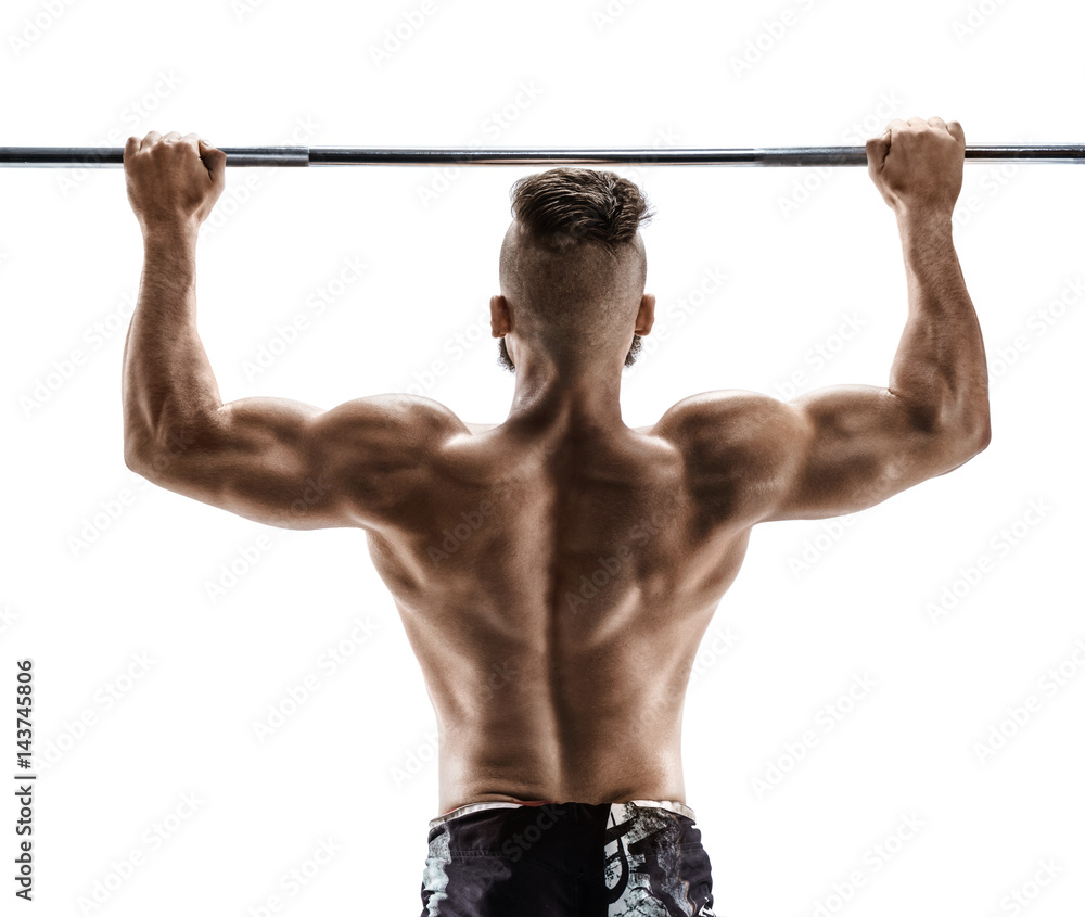 Exercise for the back. Photo of muscular fitness model doing pull ups ...