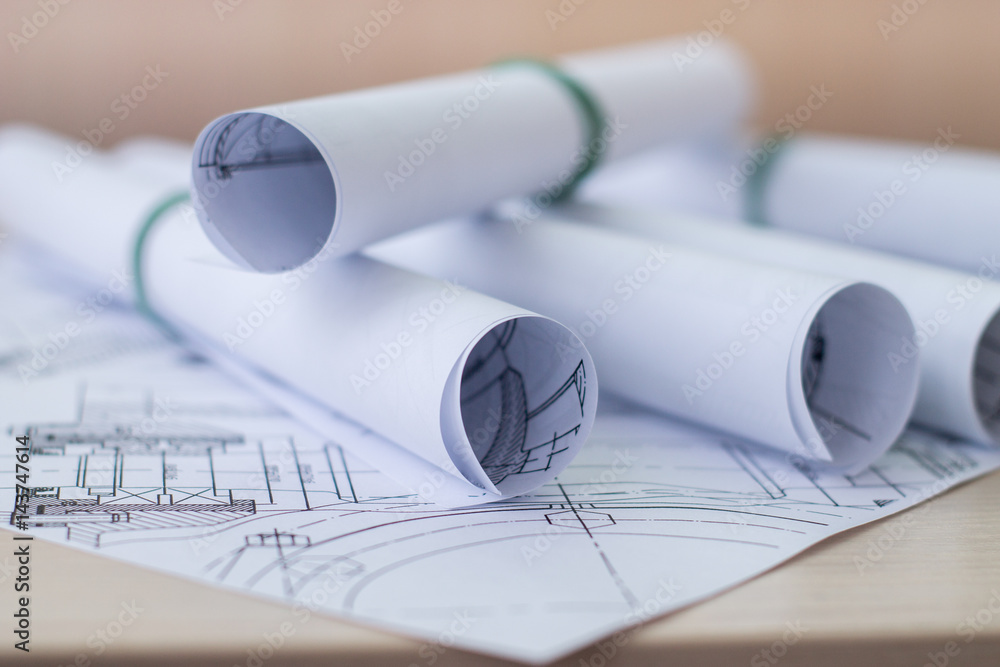 Engineering drawings on paper. Several drawings in a roll. Stock Photo ...