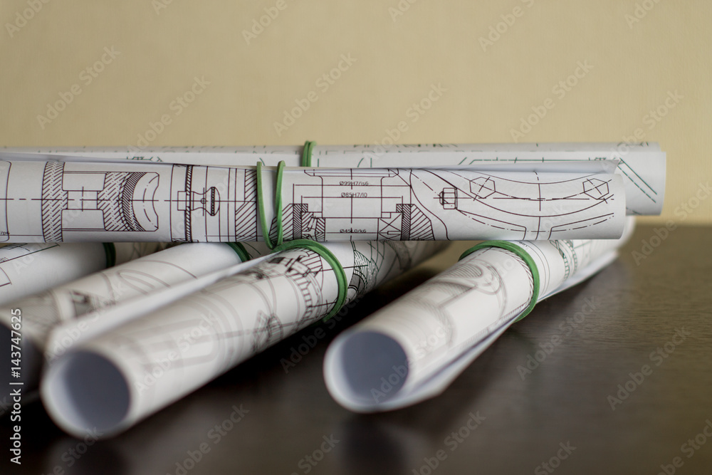 Engineering drawings on paper. Several drawings in a roll. Stock Photo ...