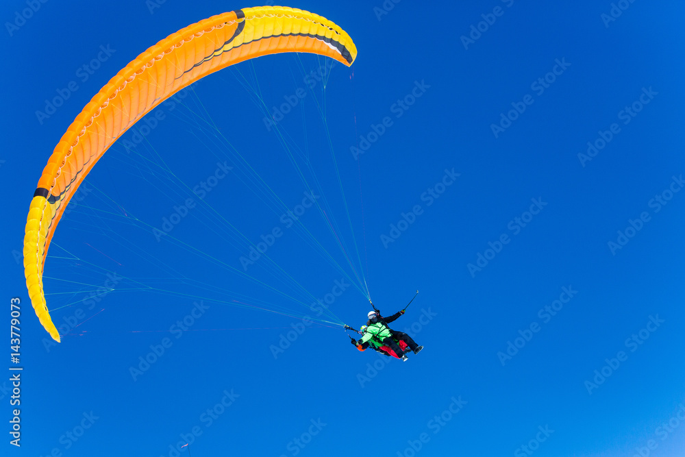 Parachute sky-diver flying in clouds above mountains. Travel adventure ...