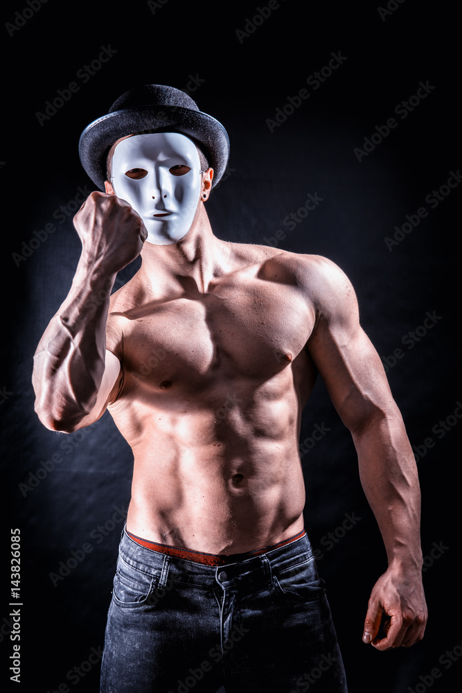 Shirtless muscle man with creepy, scary mask being aggressive and ...