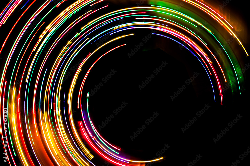 Abstract rotating neon lights texture with black empty copy space ...