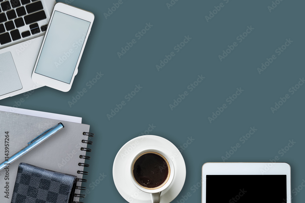 office equipment,laptop computer, smartphone with white screen over a ...