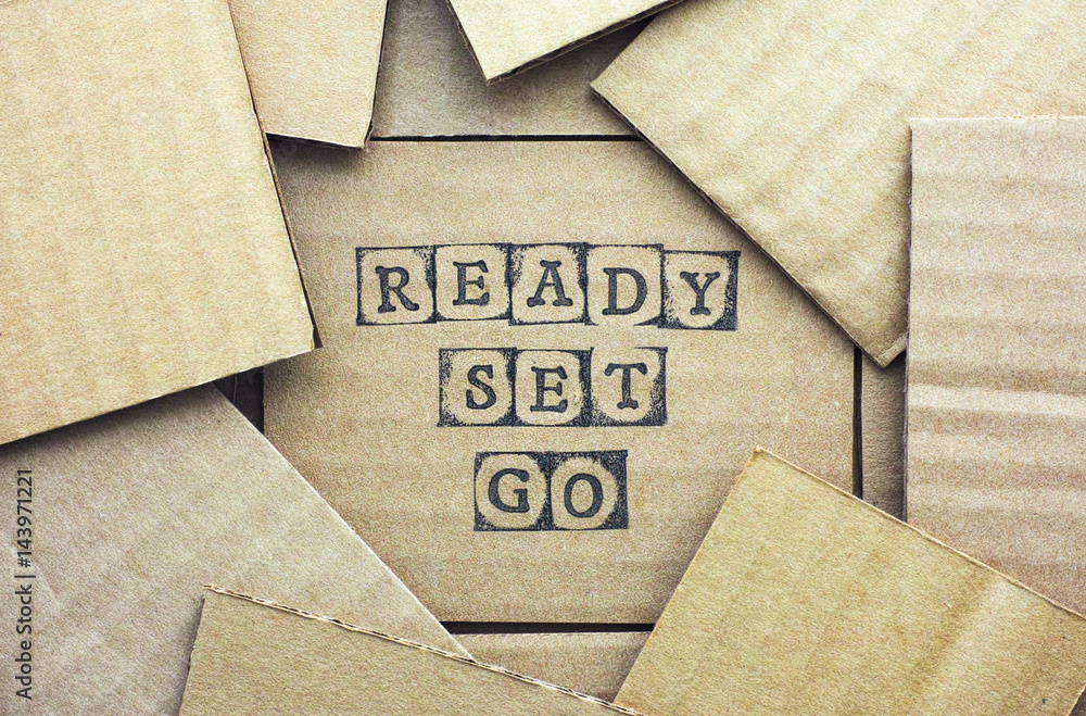 Cardboard card with words Ready Set Go made by black alphabet stamps ...