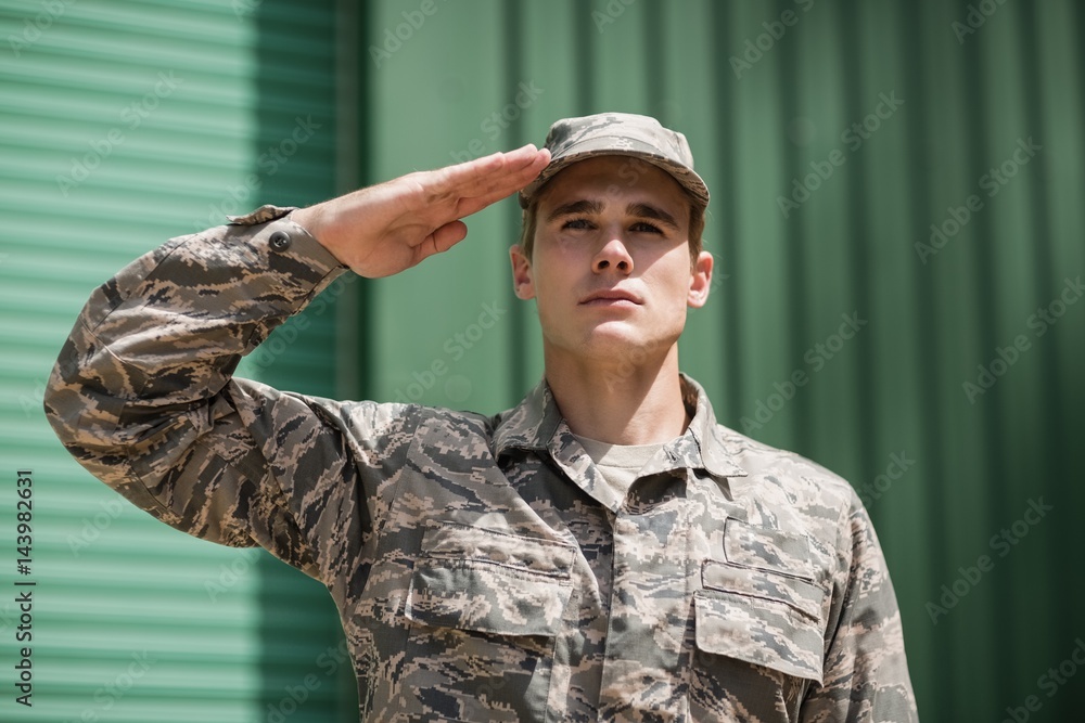 Close-up of military soldier giving salute Stock Photo | Adobe Stock