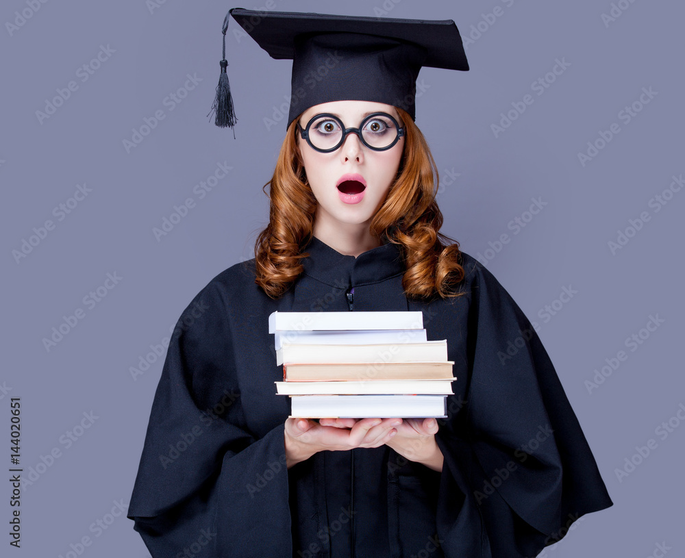 photo of beautiful young alumnus with pile of books on the wonderful ...