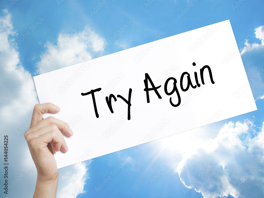 Try Again Sign on white paper. Man Hand Holding Paper with text ...