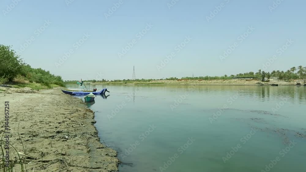 Pan right on Euphrates river at Karbala, Iraq. The Euphrates is the ...