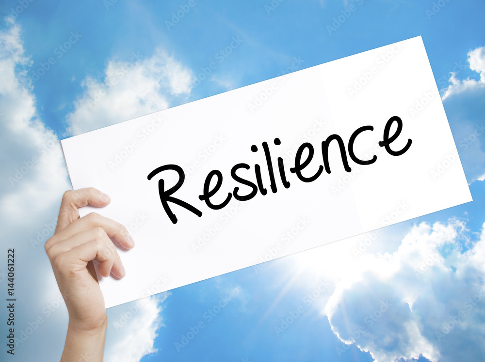 Resilience Sign on white paper. Man Hand Holding Paper with text ...
