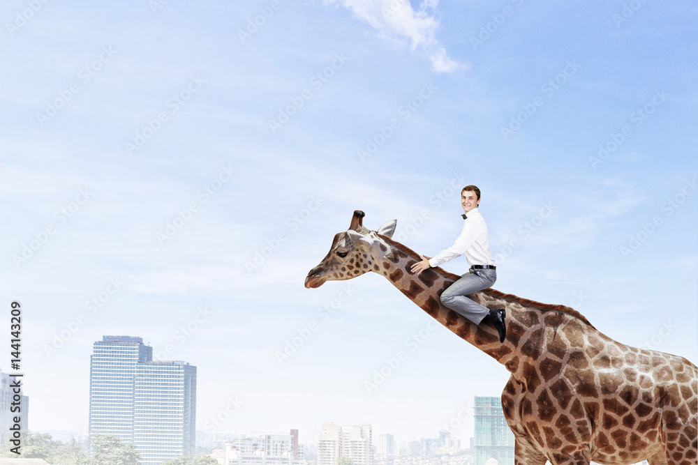 Man ride giraffe . Mixed media Stock-Foto | Adobe Stock