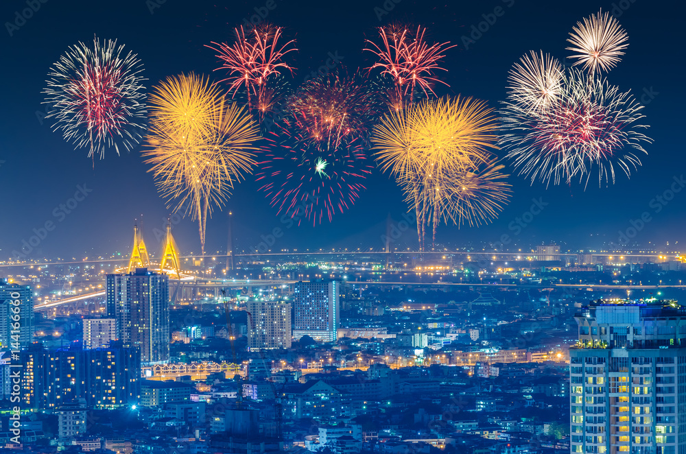 Fireworks lit up beautifully over big town in the city at blue twilight ...