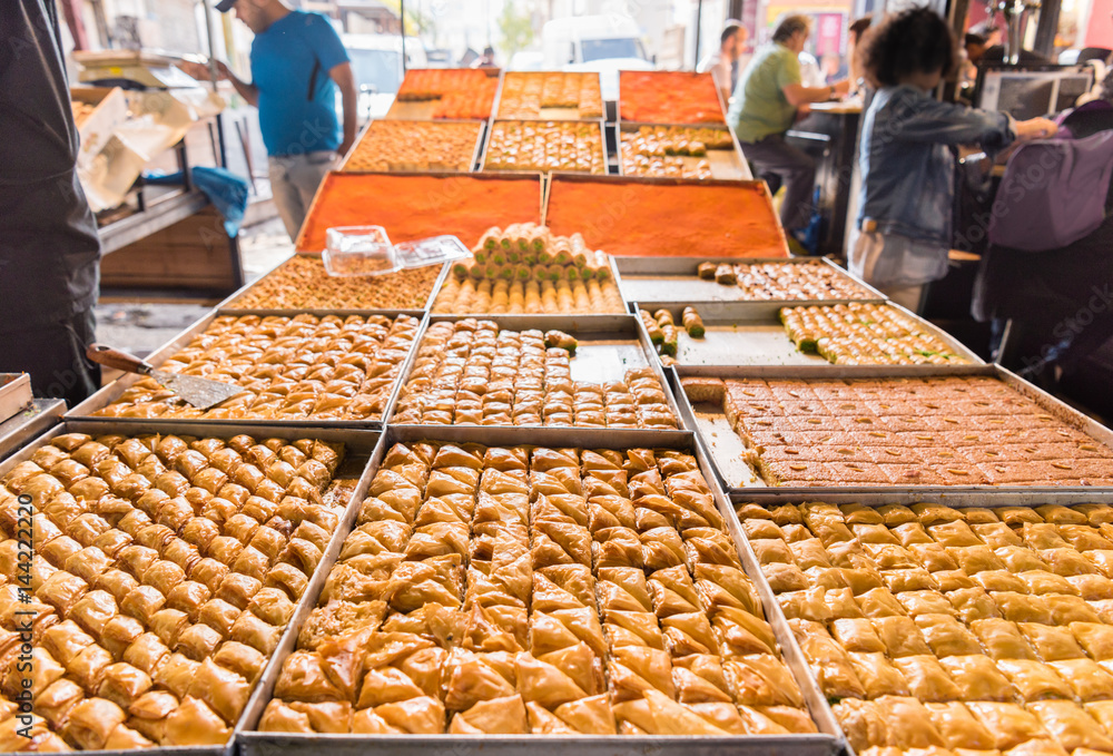 Variety of sweets on the arab street market stall. Eastern sweets in a ...