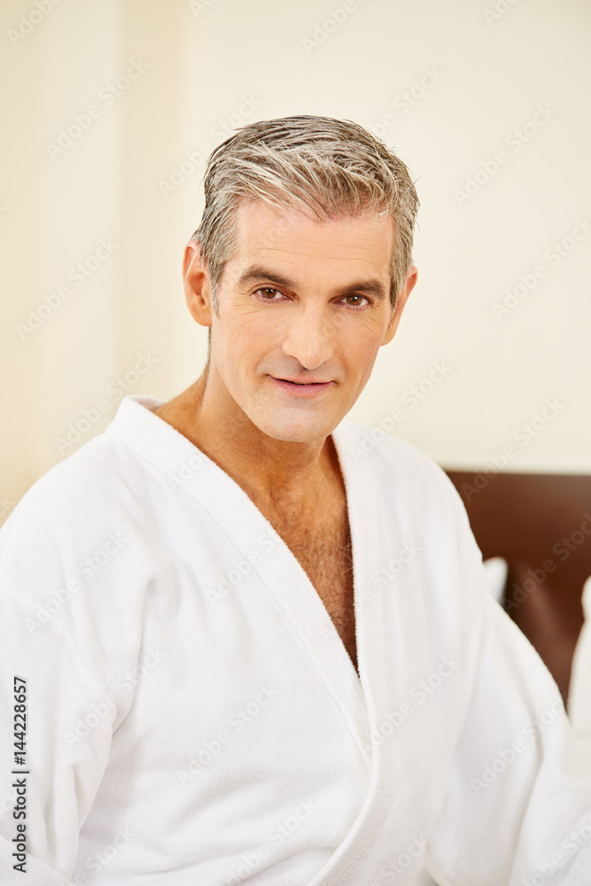 Elderly man in bathrobe in bedroom Stock Photo | Adobe Stock